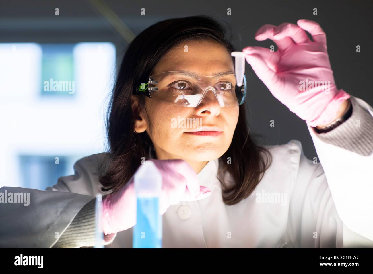 Middle aged technician in laboratory with lab coat, Freiburg, Baden ...