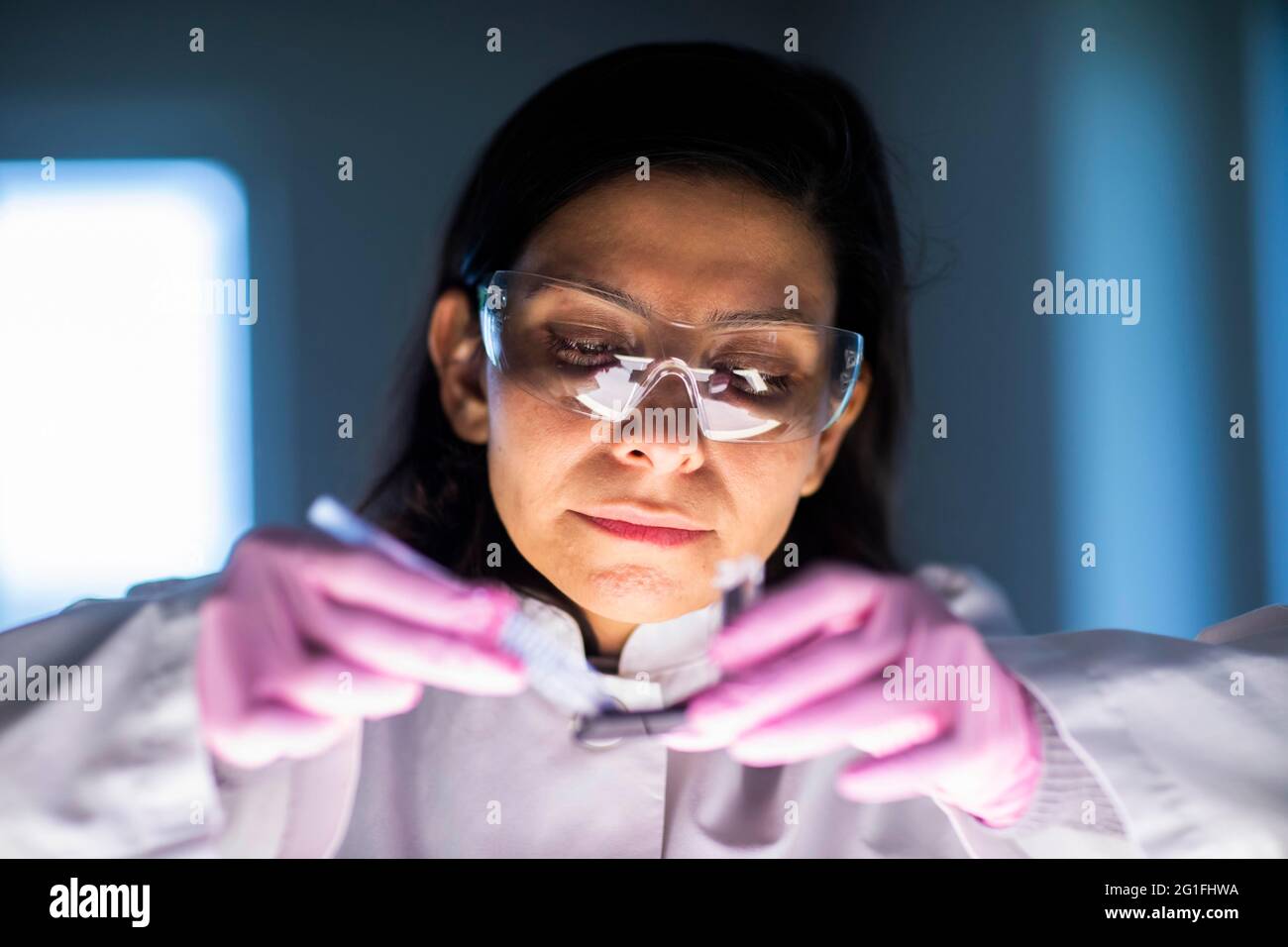 Middle aged technician in laboratory with lab coat, Freiburg, Baden ...