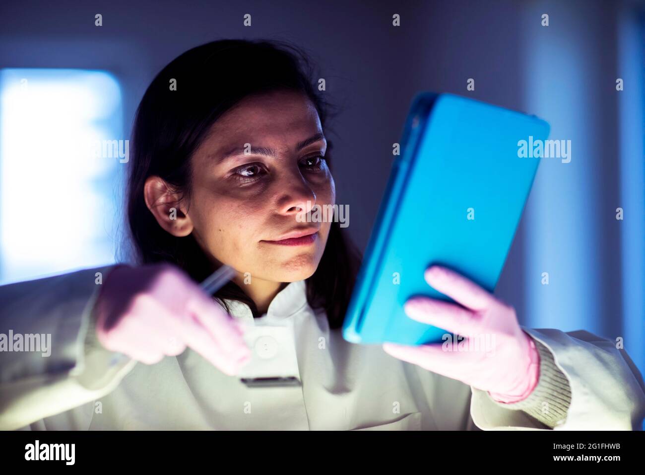 Middle aged technician in lab with lab coat, Freiburg, BW Stock Photo ...