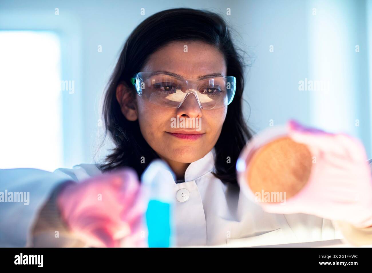 Middle aged technician in laboratory with lab coat, Freiburg, Baden ...