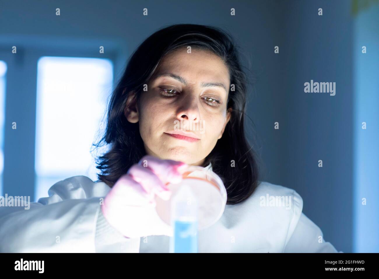 Middle aged technician in laboratory with lab coat, Freiburg, Baden ...