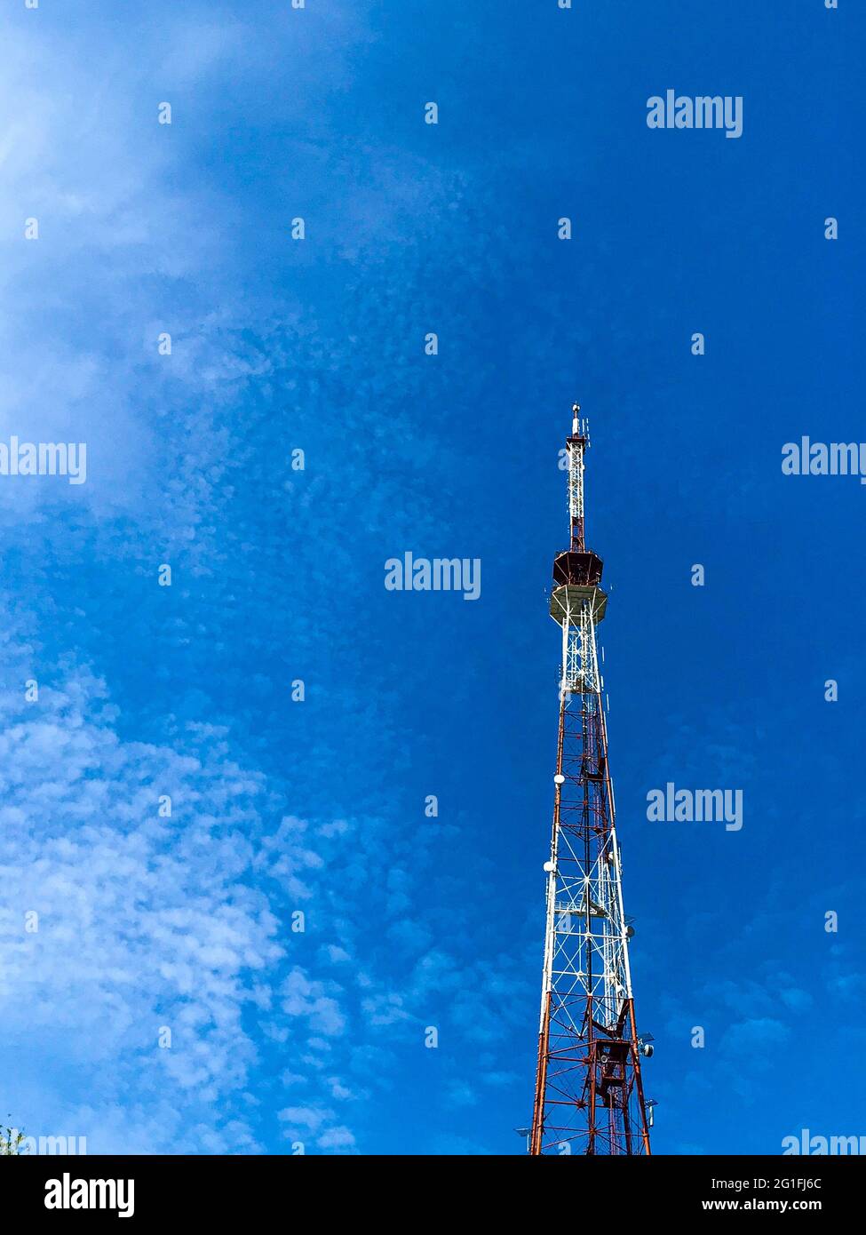 A TV-radio tower. against the blue sky. The radio tower. Tv tower Stock ...