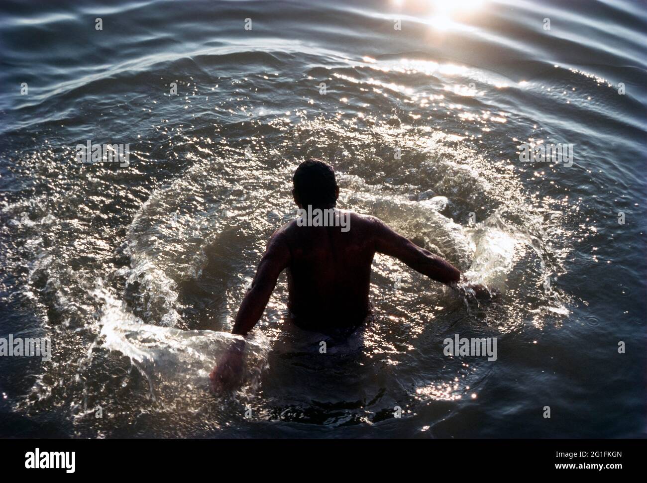 Sun Rise; Taking holy bath in River Ganga Varanasi, India Stock Photo ...