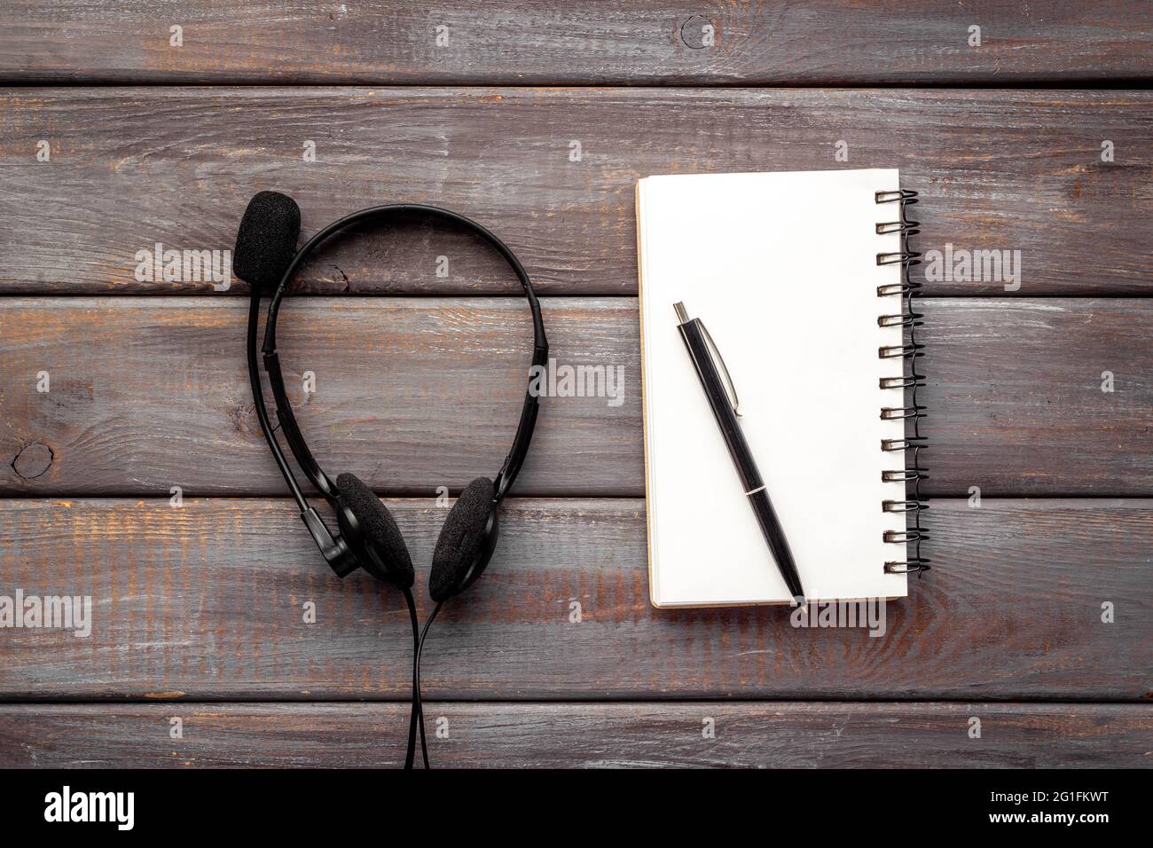 Voip headset on office desk. Call center support or customer service ...