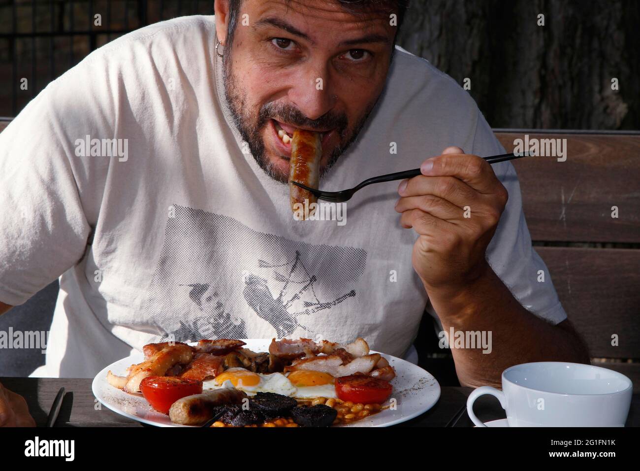 Full english breakfast man hi-res stock photography and images - Alamy