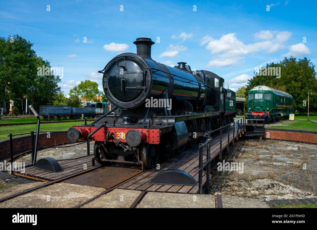 Steam Train on rail turn table Stock Photo - Alamy