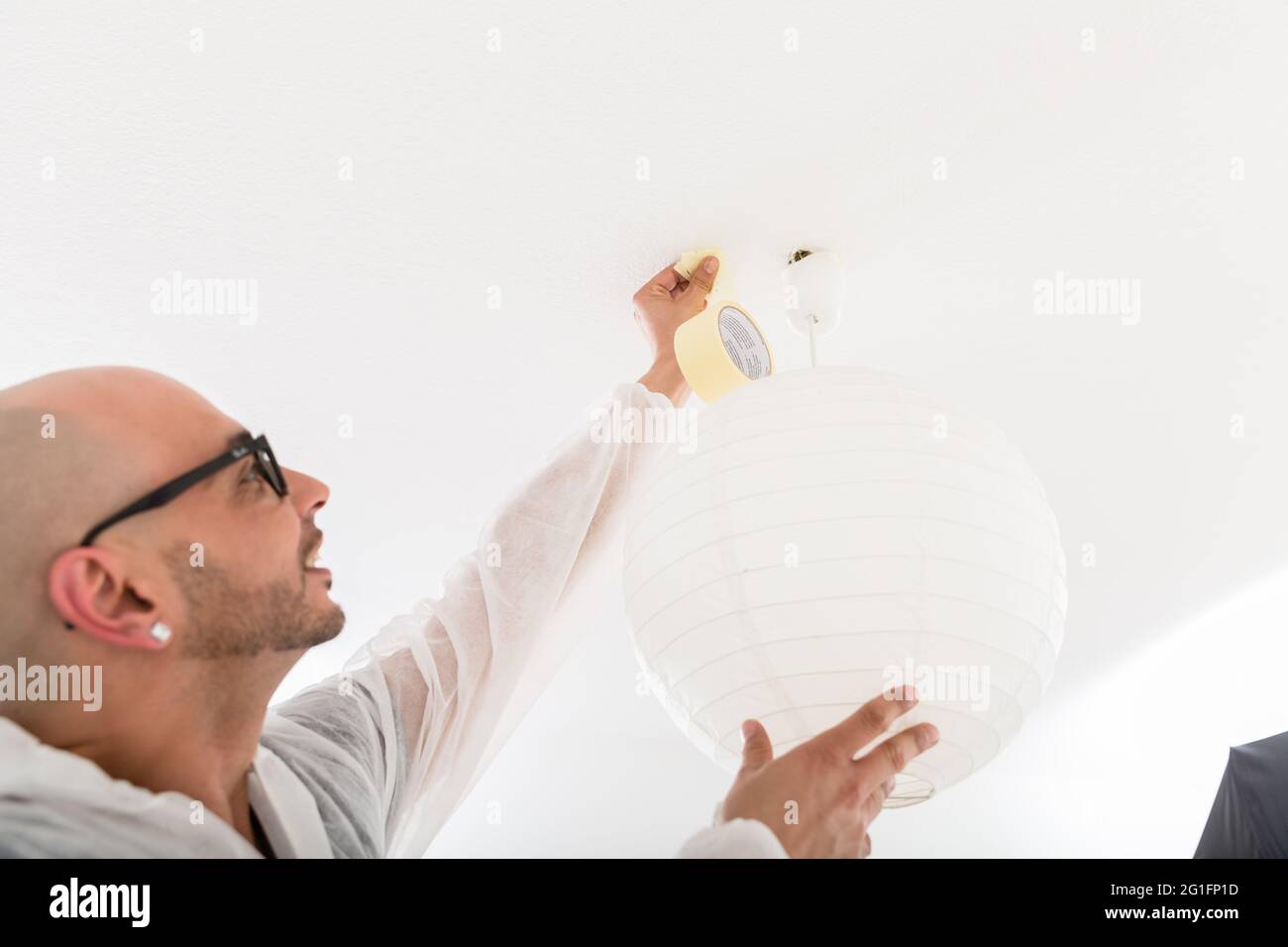 Man hanging by one arm hi-res stock photography and images - Alamy