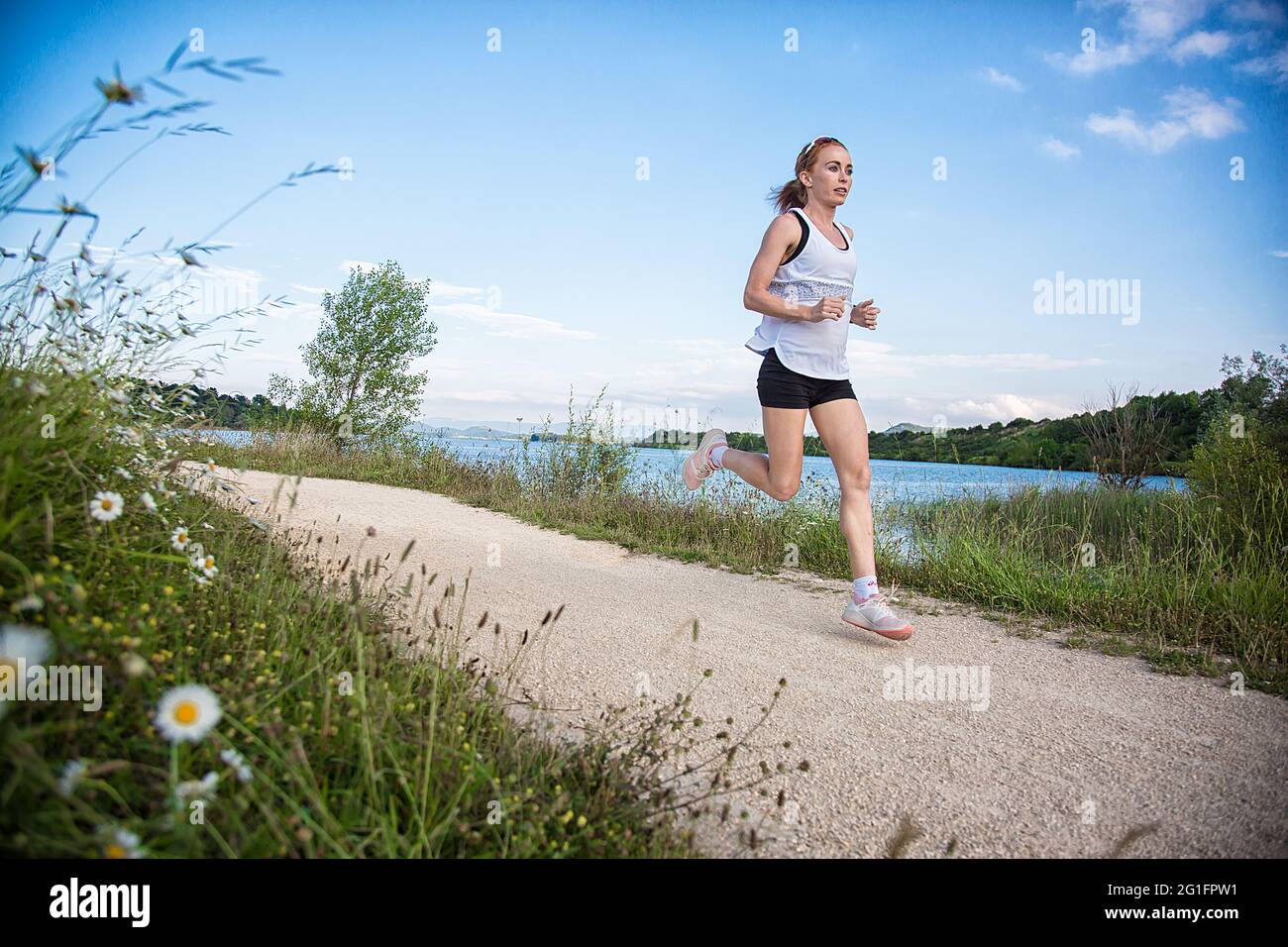 Girl running in nature, it is her healthy and free lifestyle Stock ...