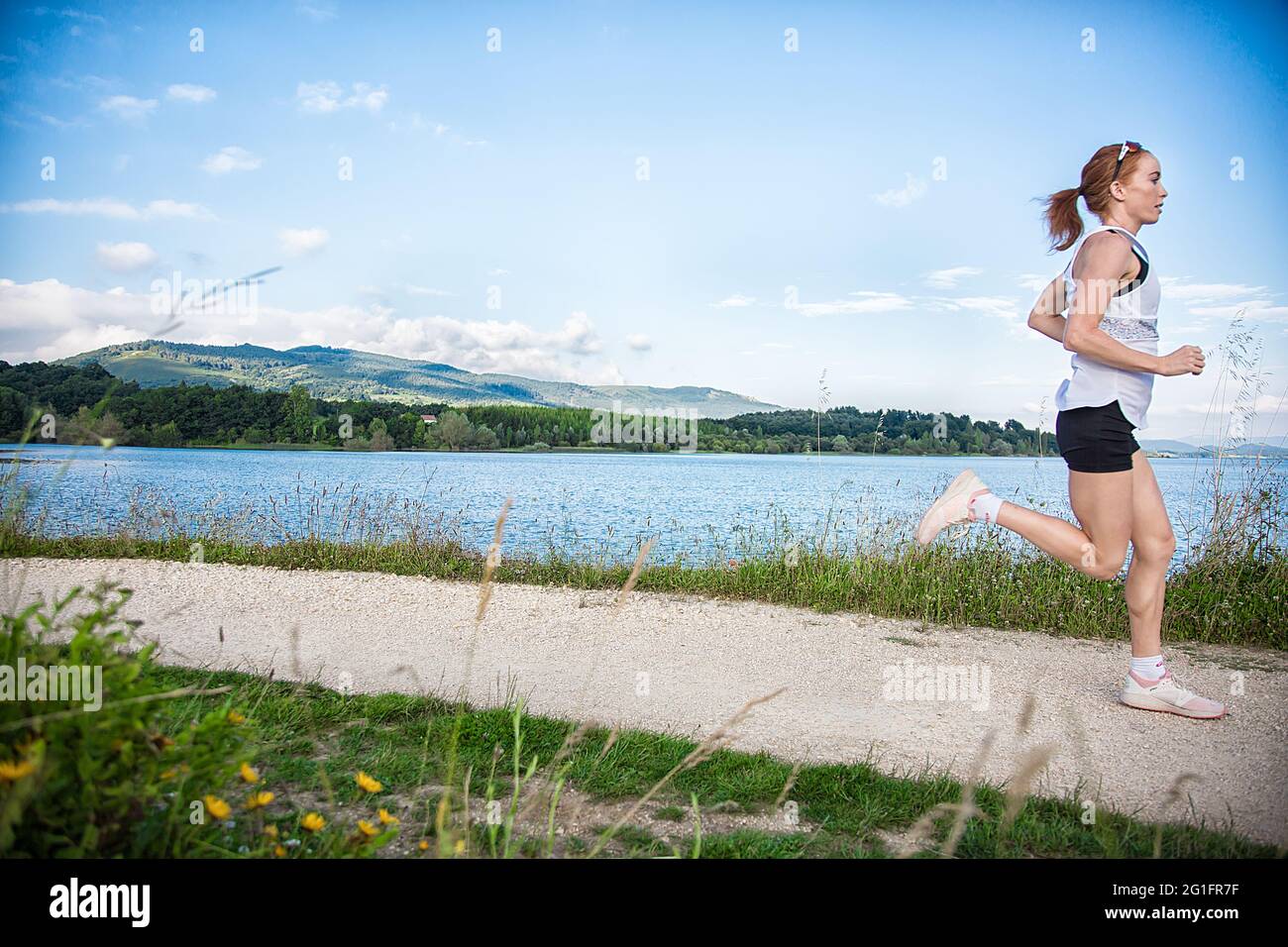 Girl running in nature, it is her healthy and free lifestyle Stock ...