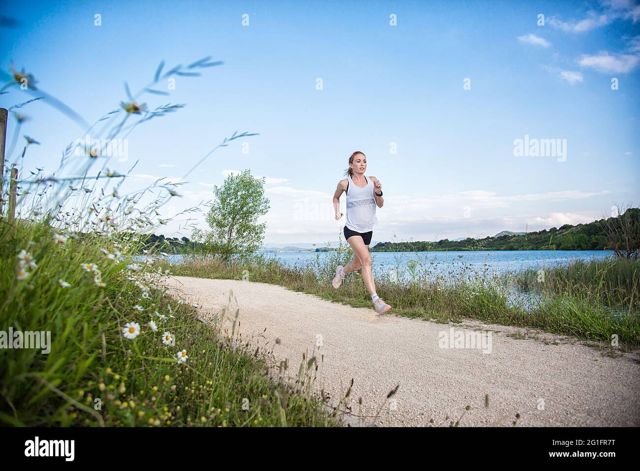 Girl running in nature, it is her healthy and free lifestyle Stock ...