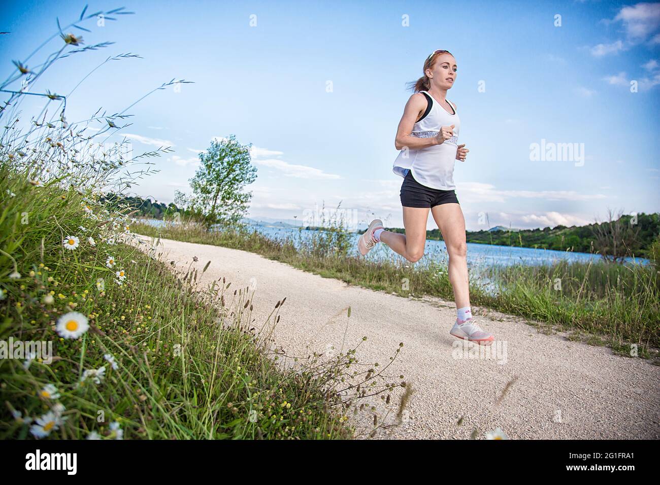 Girl running in nature, it is her healthy and free lifestyle Stock ...
