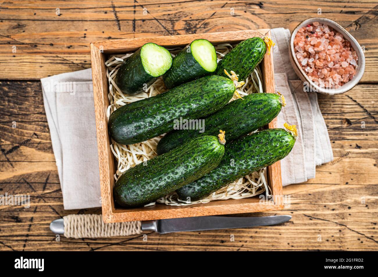 Fresh Green Cucumbers in a wooden box. Wooden background. Top view ...