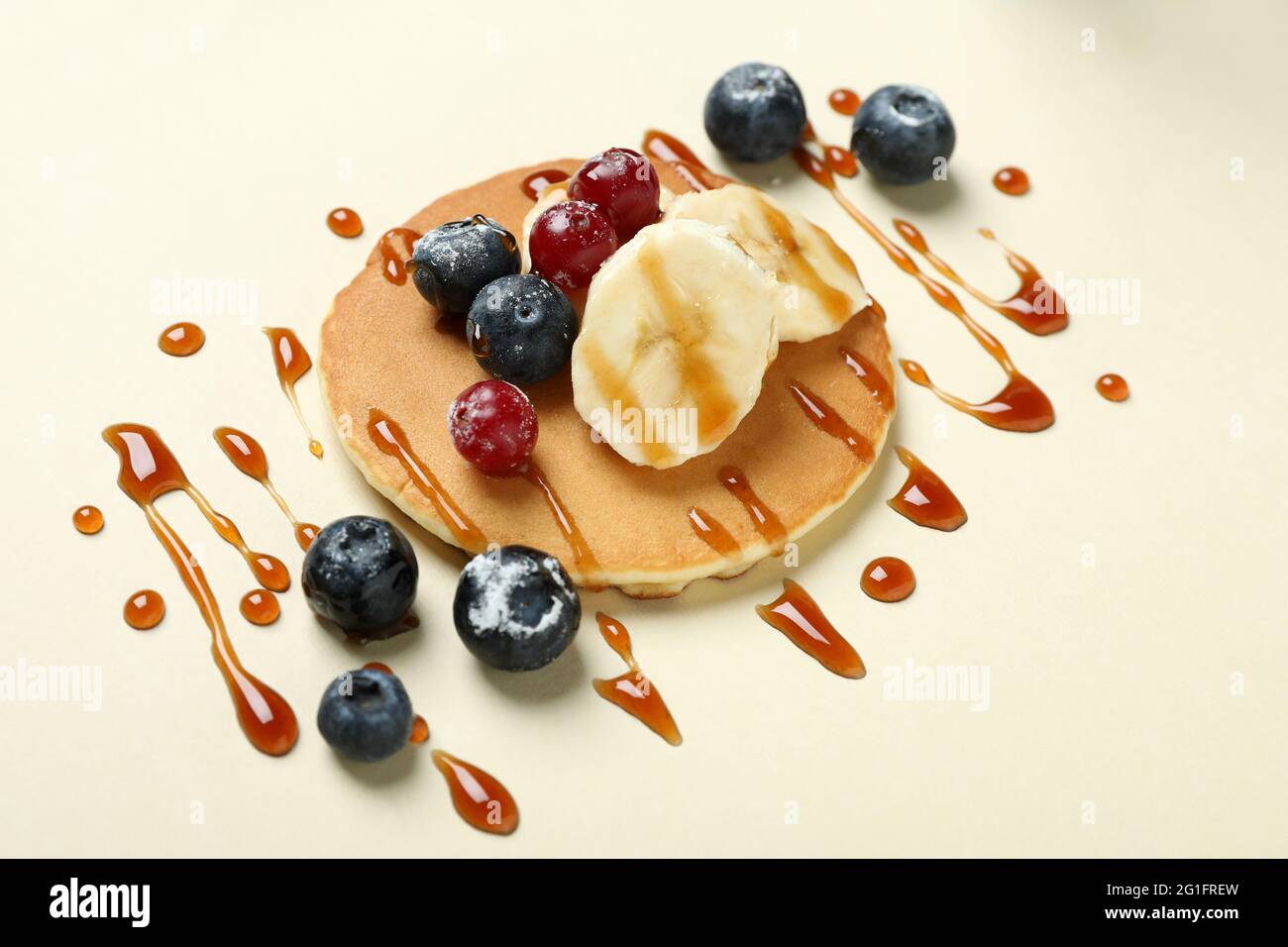Concept of tasty food with pancake on beige background Stock Photo - Alamy