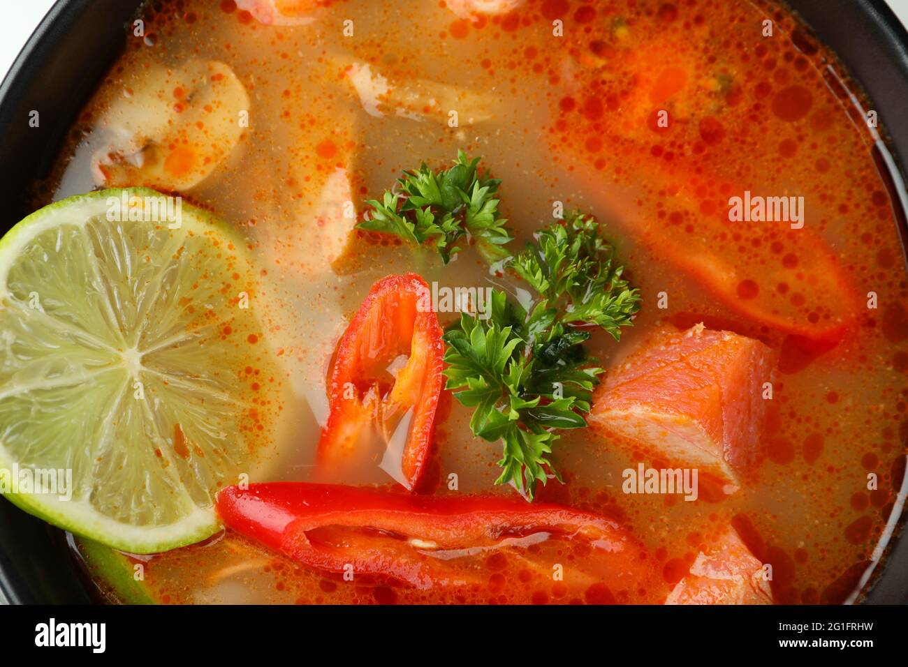 Plate of tasty Tom yum soup, close up Stock Photo - Alamy