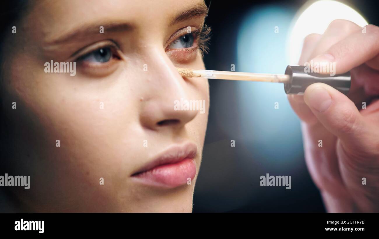 Makeup artist applying concealer hi-res stock photography and images ...