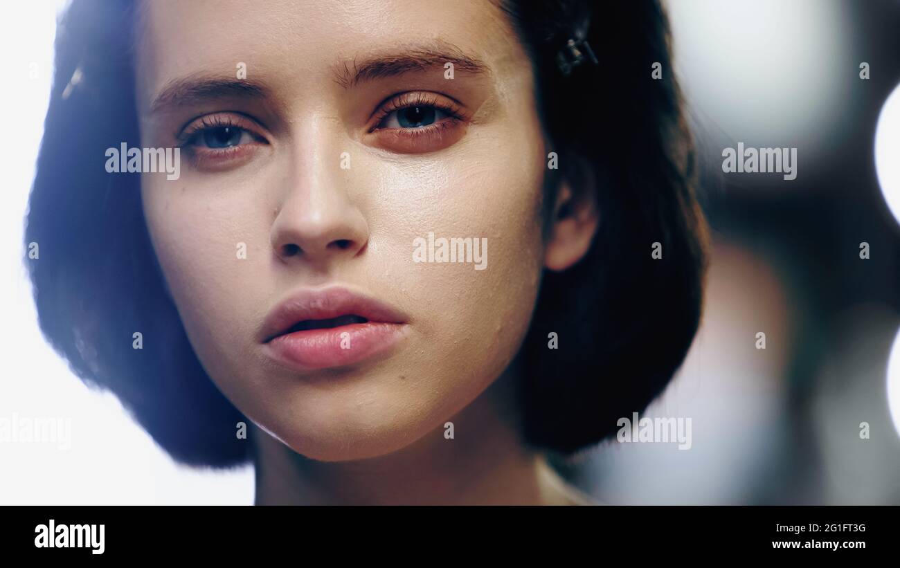 young model with makeup foundation on face looking away Stock Photo - Alamy