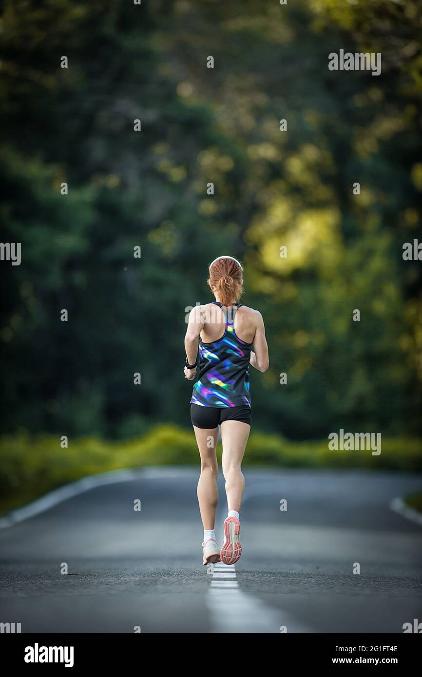 Girl running in nature, it is her healthy and free lifestyle Stock ...