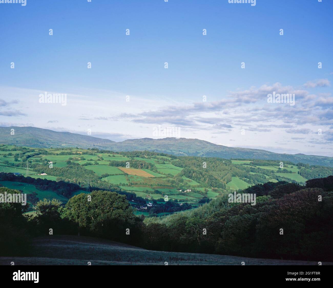 Summer morning the Conwy Valley viewed from hills above the village of ...