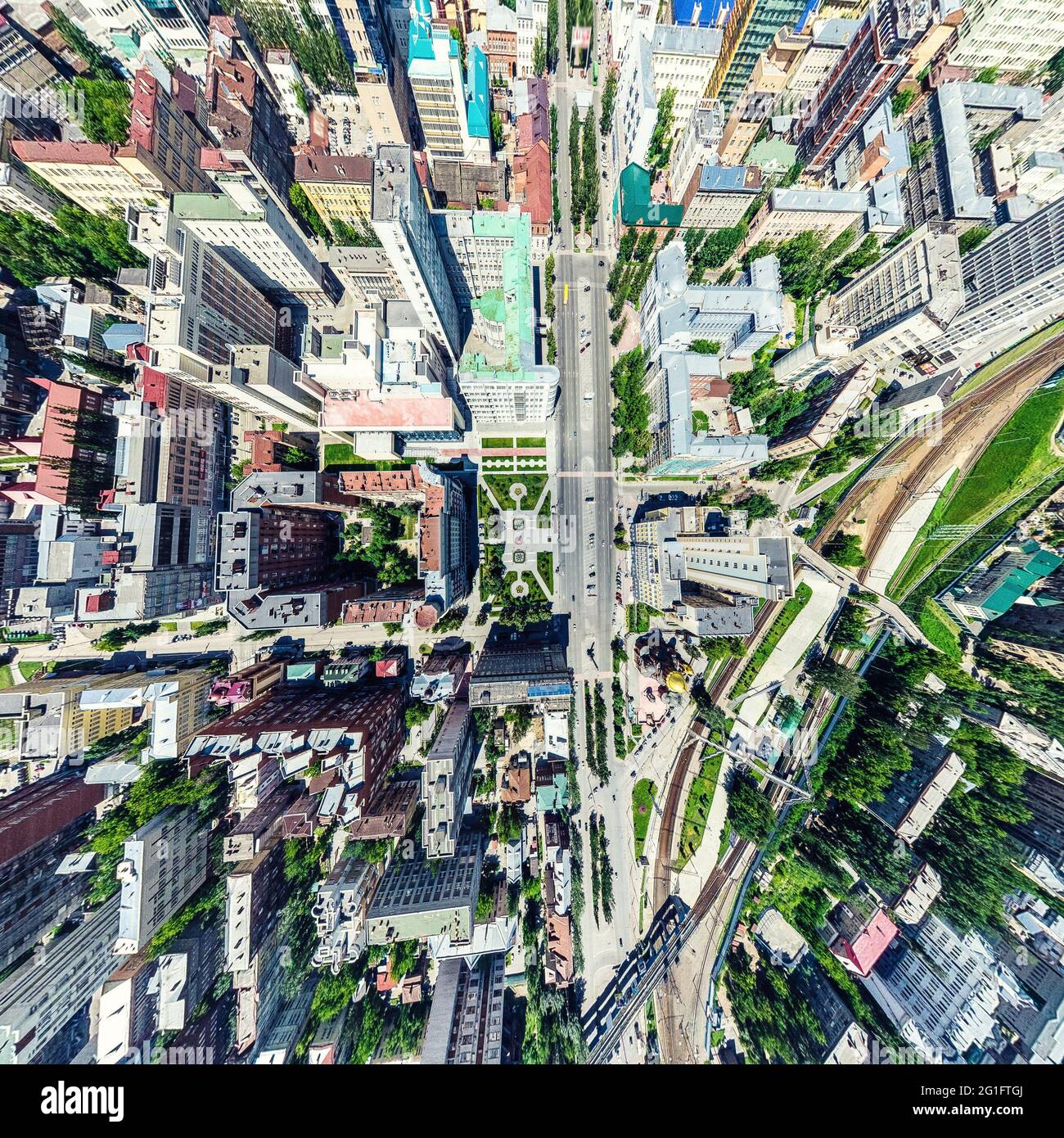 Aerial city view with crossroads and roads, houses, buildings, parks ...