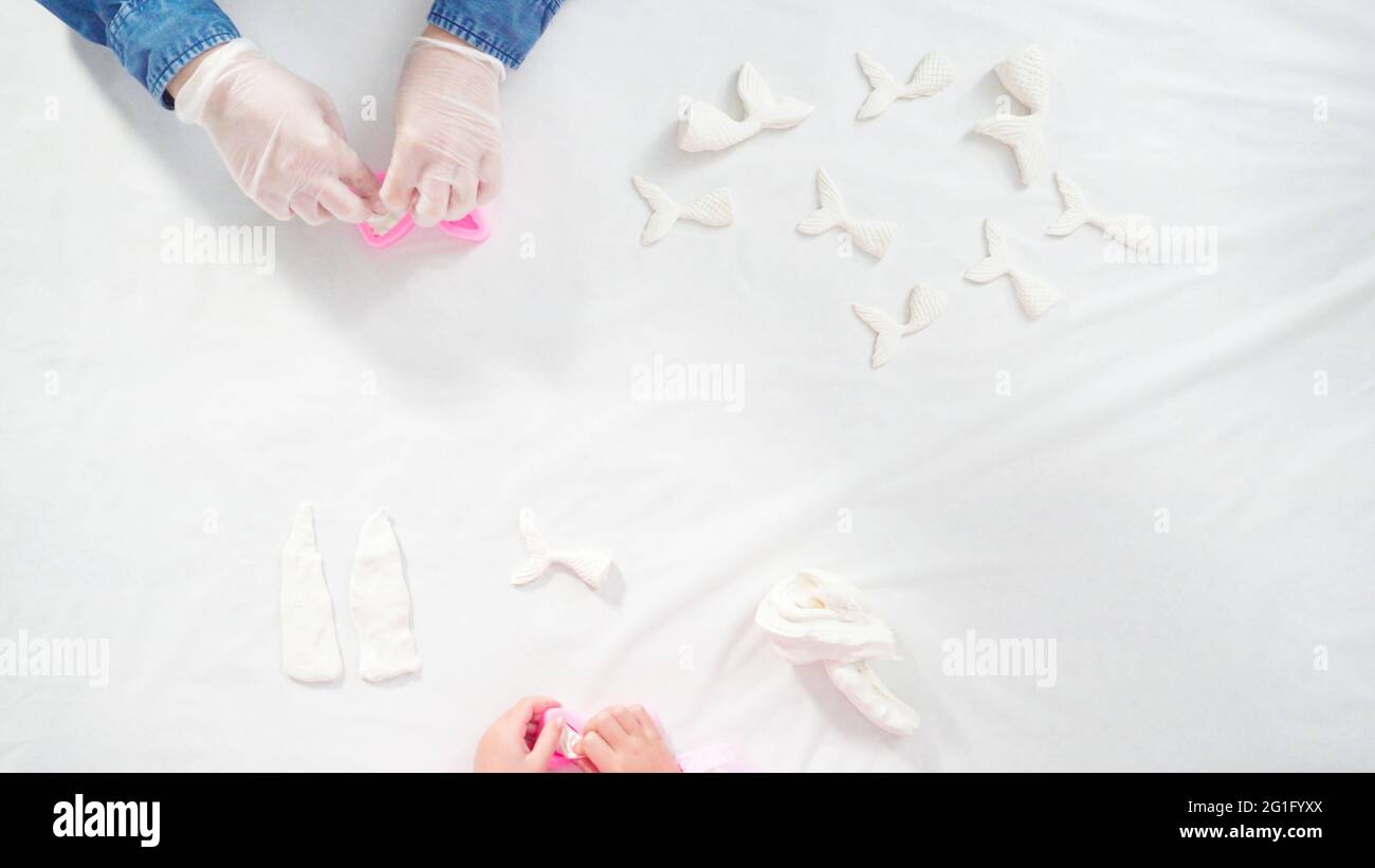 Flat lay. Step by step. Making mermaid tail from modeling clay in ...