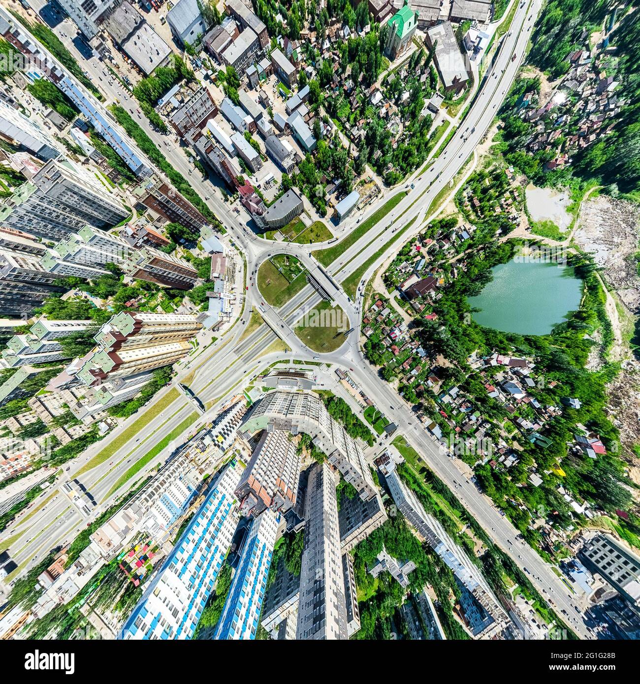 Aerial city view with crossroads and roads, houses, buildings, parks ...
