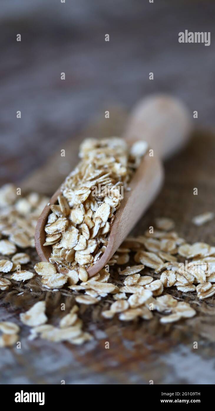 Oatmeal in a wooden spatula Stock Photo - Alamy