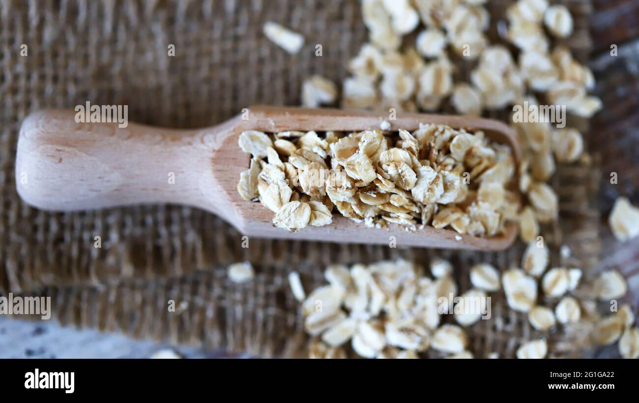 Oatmeal in a wooden spatula Stock Photo - Alamy