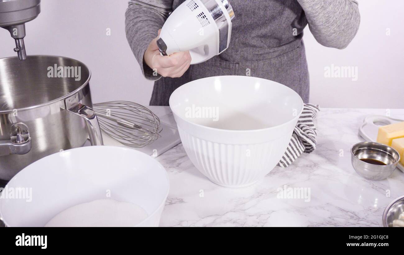 Step by step. Mixing ingredients in standing kitchen mixer to bake ...
