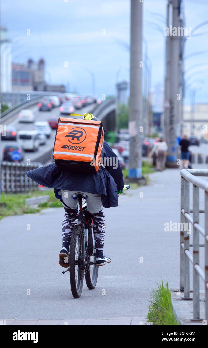 Fast express delivery service, courier rides byke in hurry on the ...