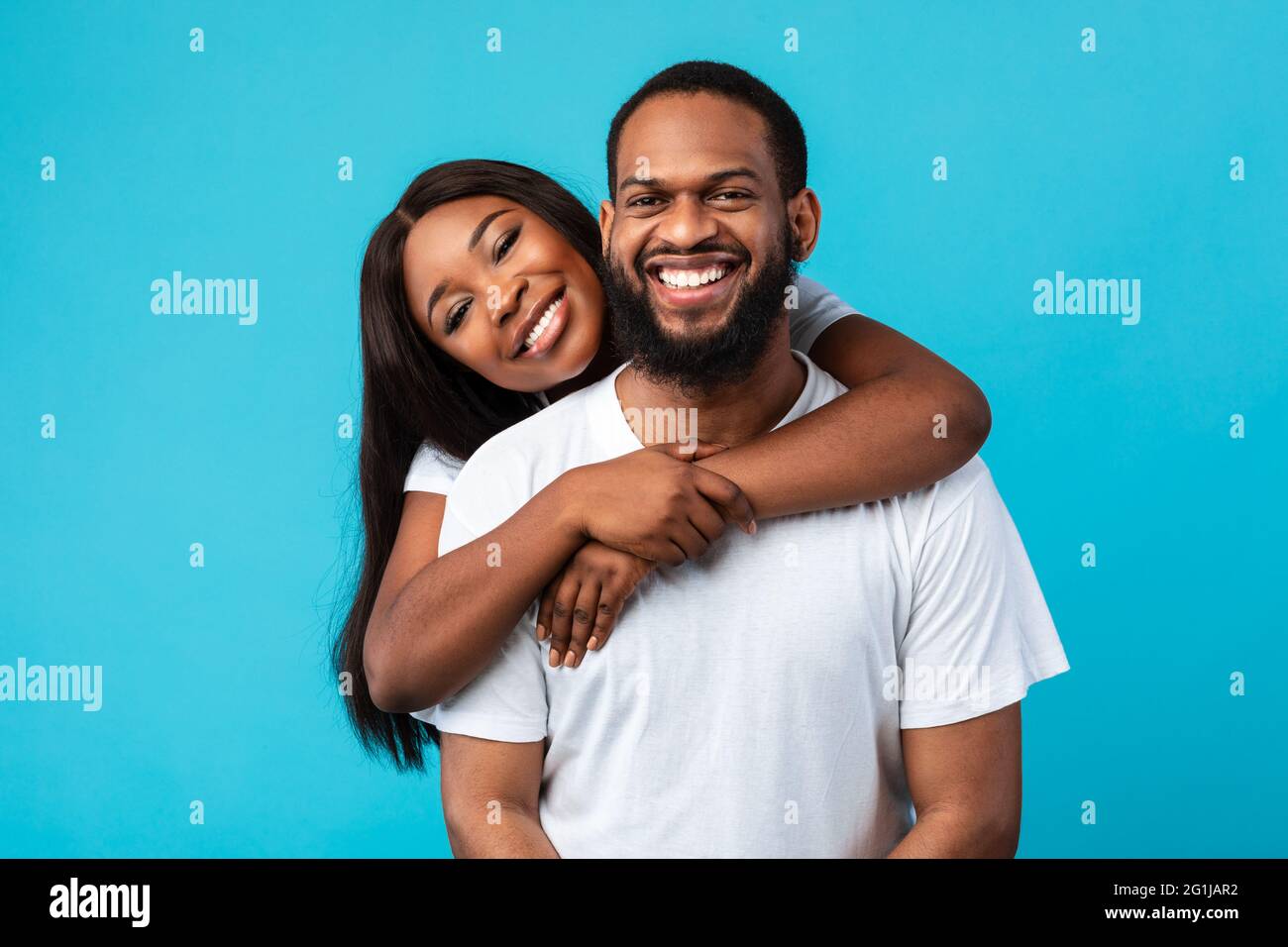 African American woman cuddling with her man Stock Photo - Alamy