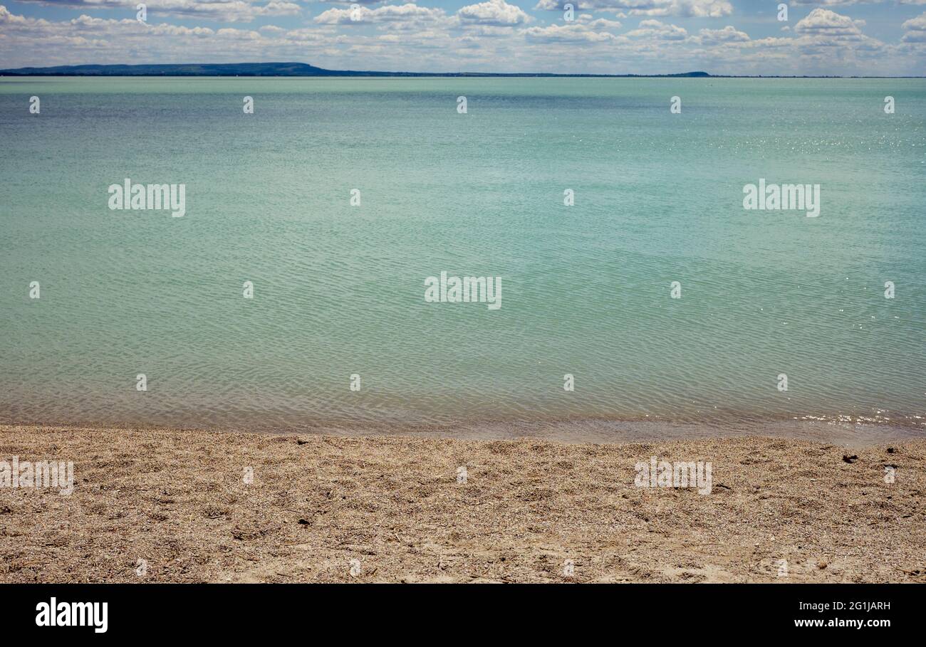 sand lake shore during summer and blue water Stock Photo - Alamy