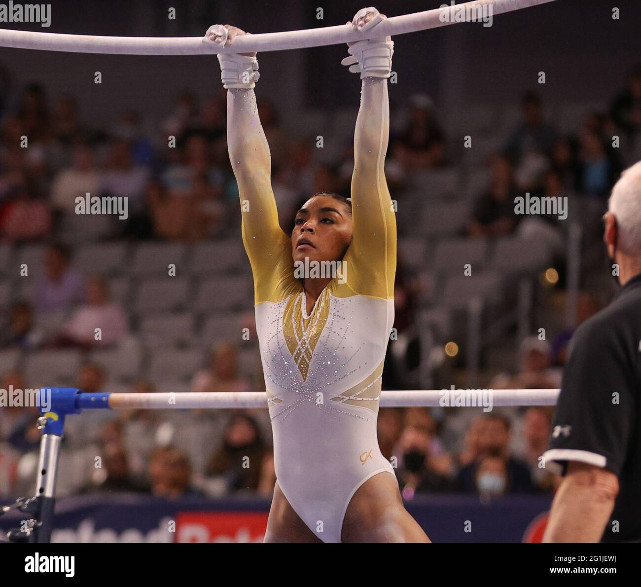 June 6, 2021: EMjae Frazier swings from the uneven parallel bars during ...