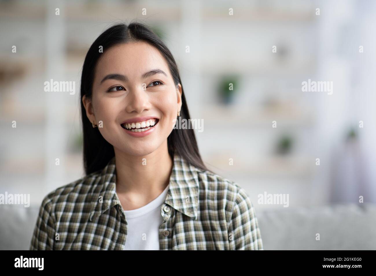 Joyful young lady sitting hi-res stock photography and images - Alamy