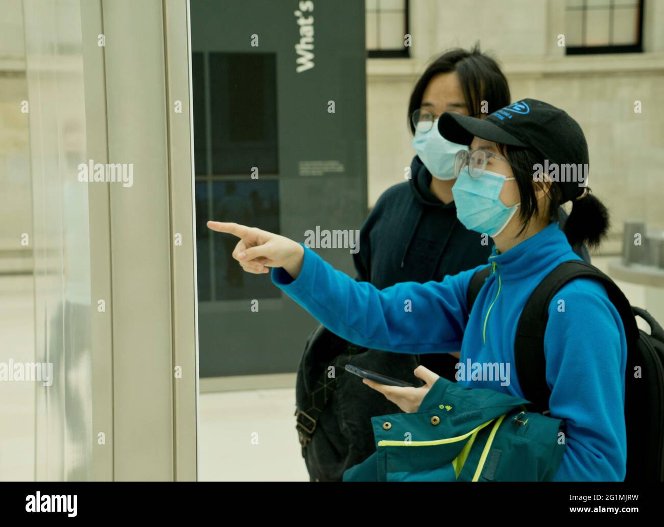 Visitors to the British Museum in London,wearing masks due to COVID-19 ...