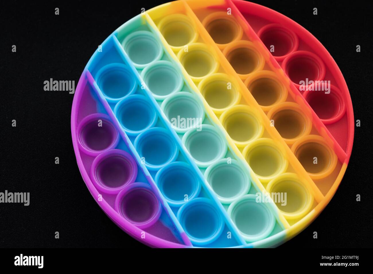 Colorful Pop It Fidget Toy On Dark Background Stock Photo - Alamy