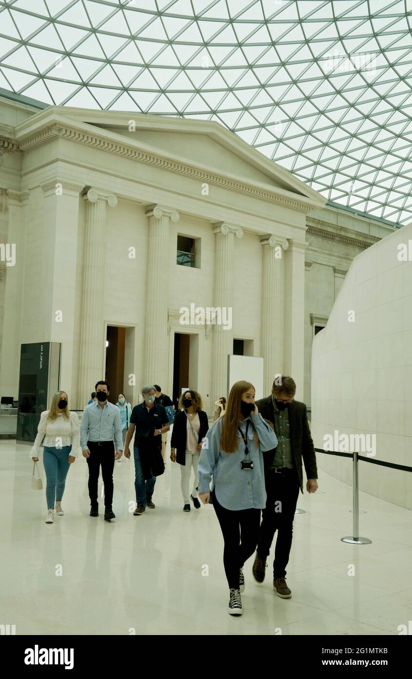 Visitors to the British Museum in London,wearing masks due to COVID-19 ...