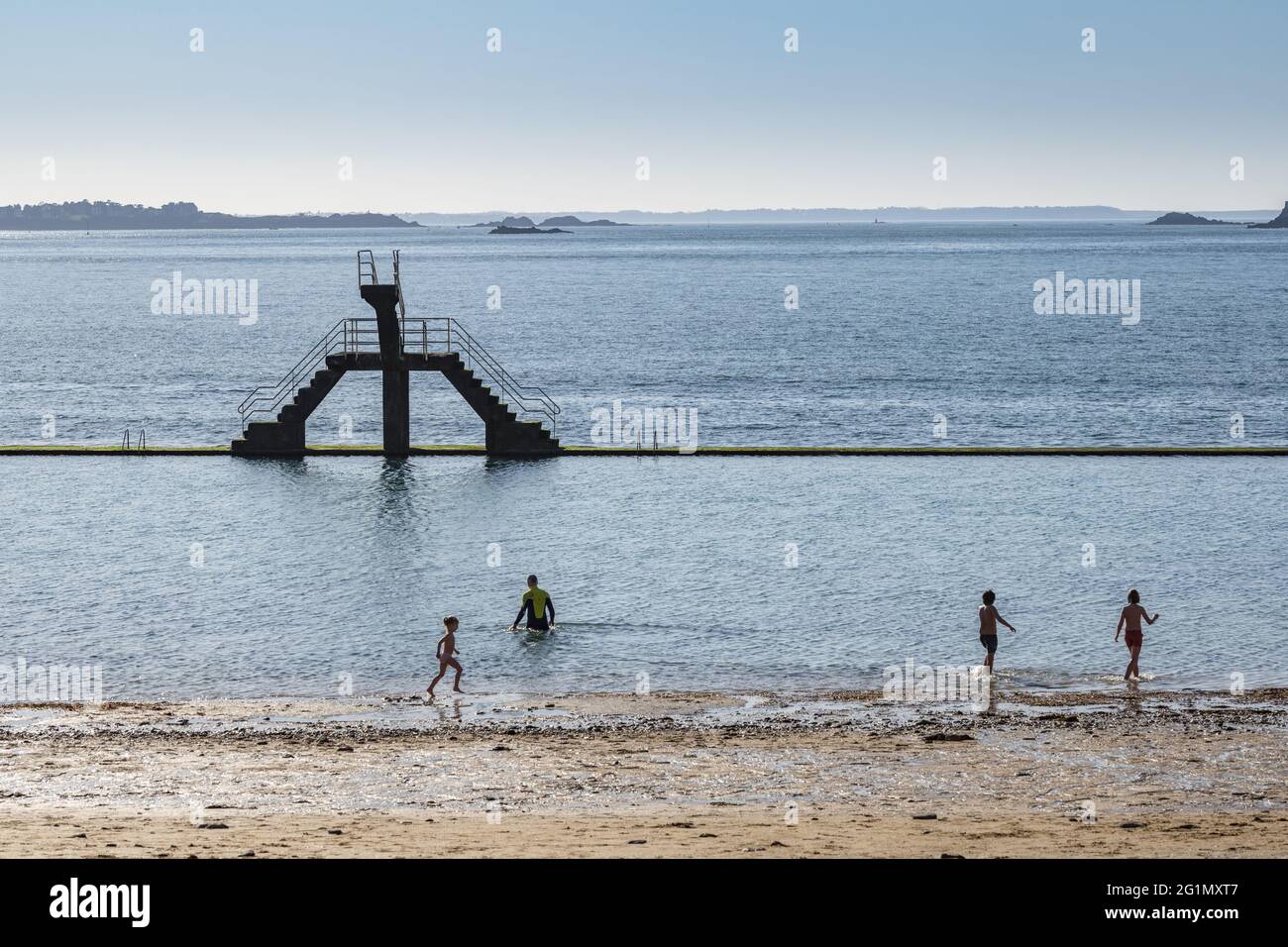 France, Ile et Vilaine, Saint Malo, silhouettes in the sea water ...