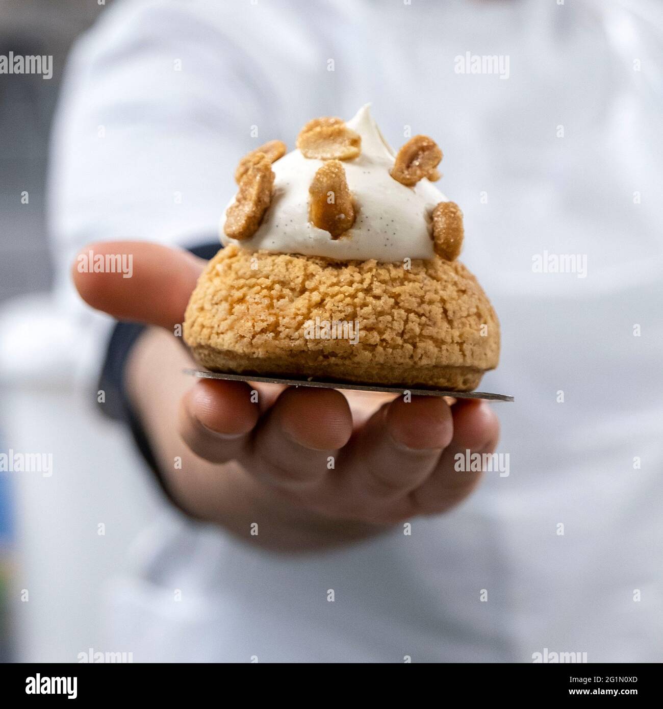 France, Paris, Peanut cream puffs from Maison Marques pastry shop Stock ...