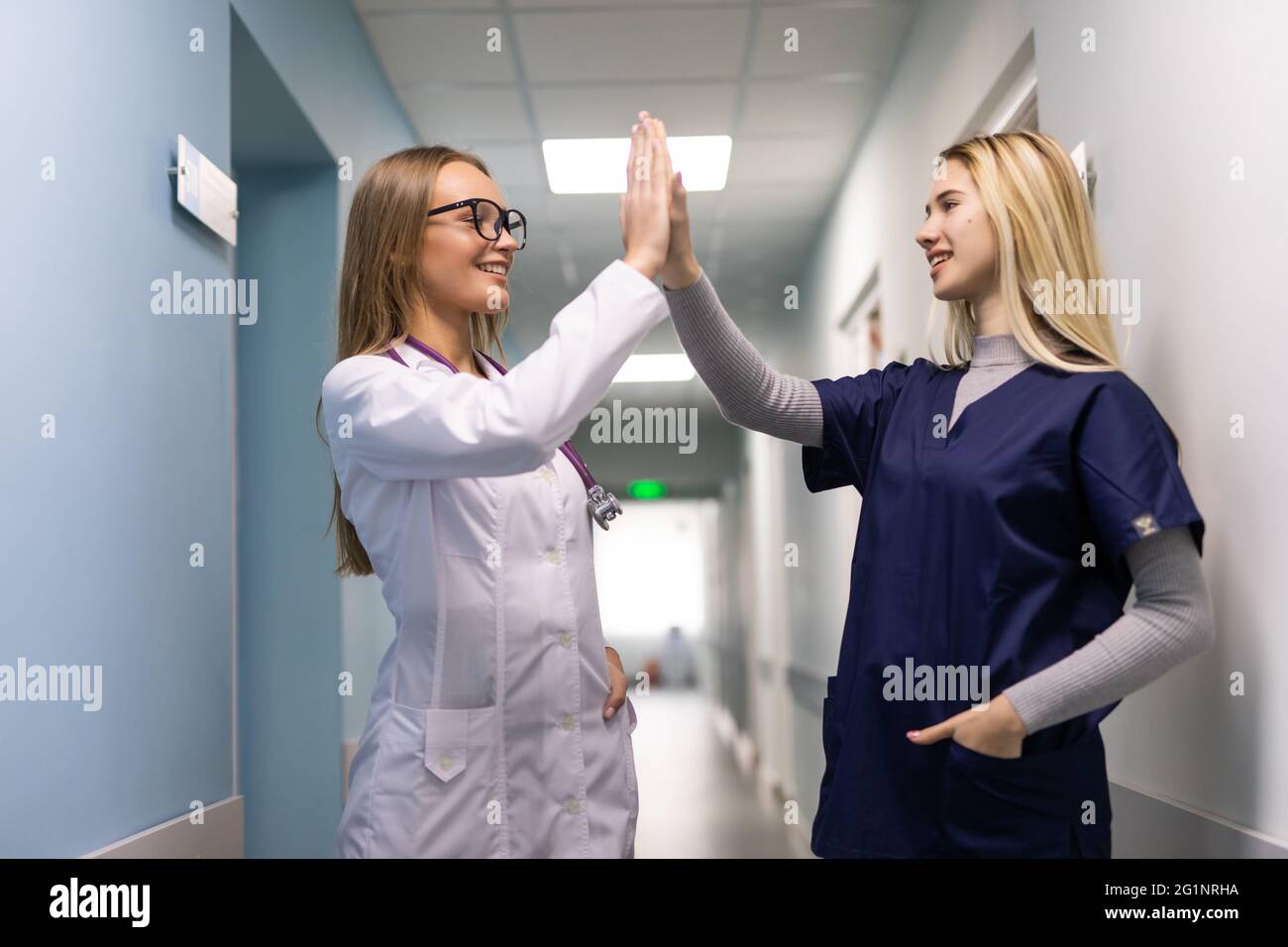 Doctors team of surgery gives high five motivation in a hospital Stock ...