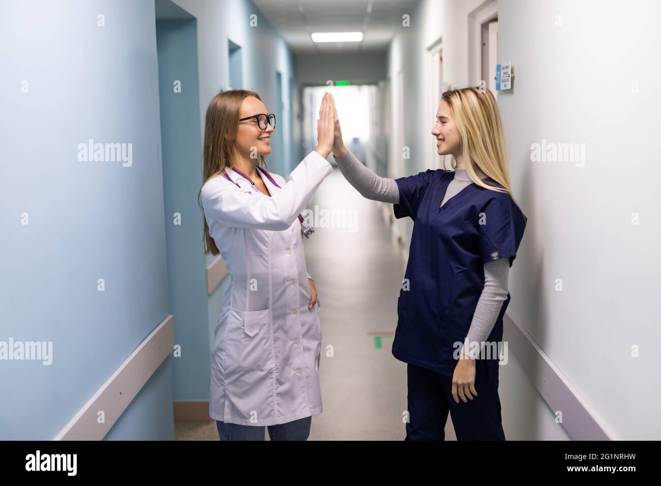 Doctors team of surgery gives high five motivation in a hospital Stock ...