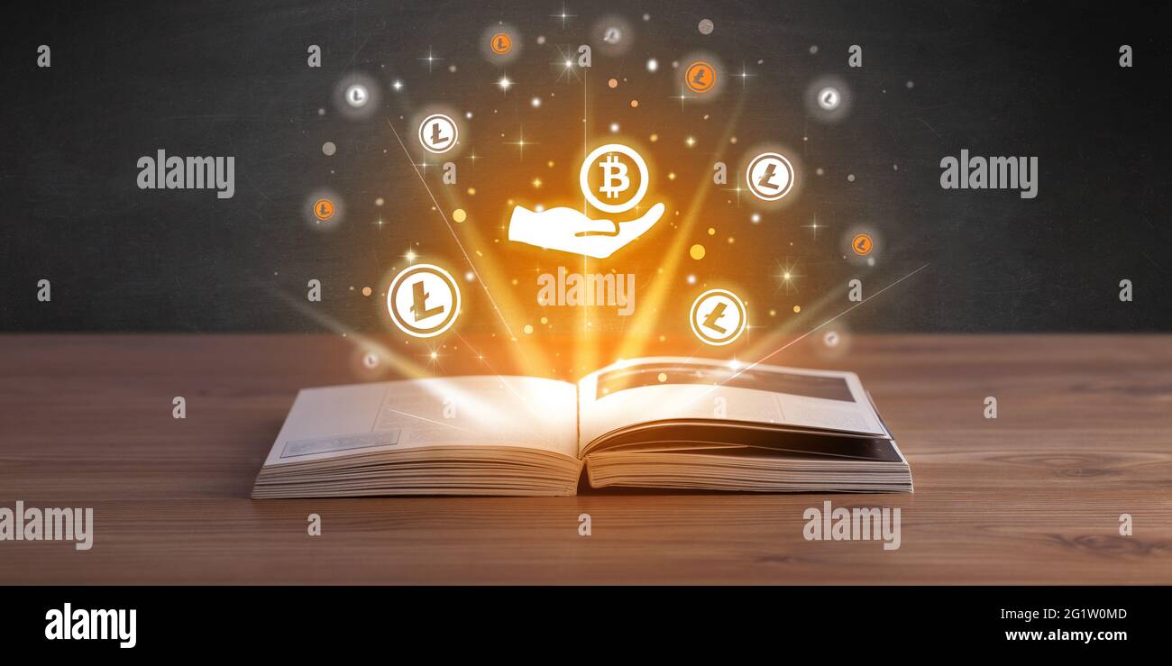 Open book with currency icons above Stock Photo - Alamy