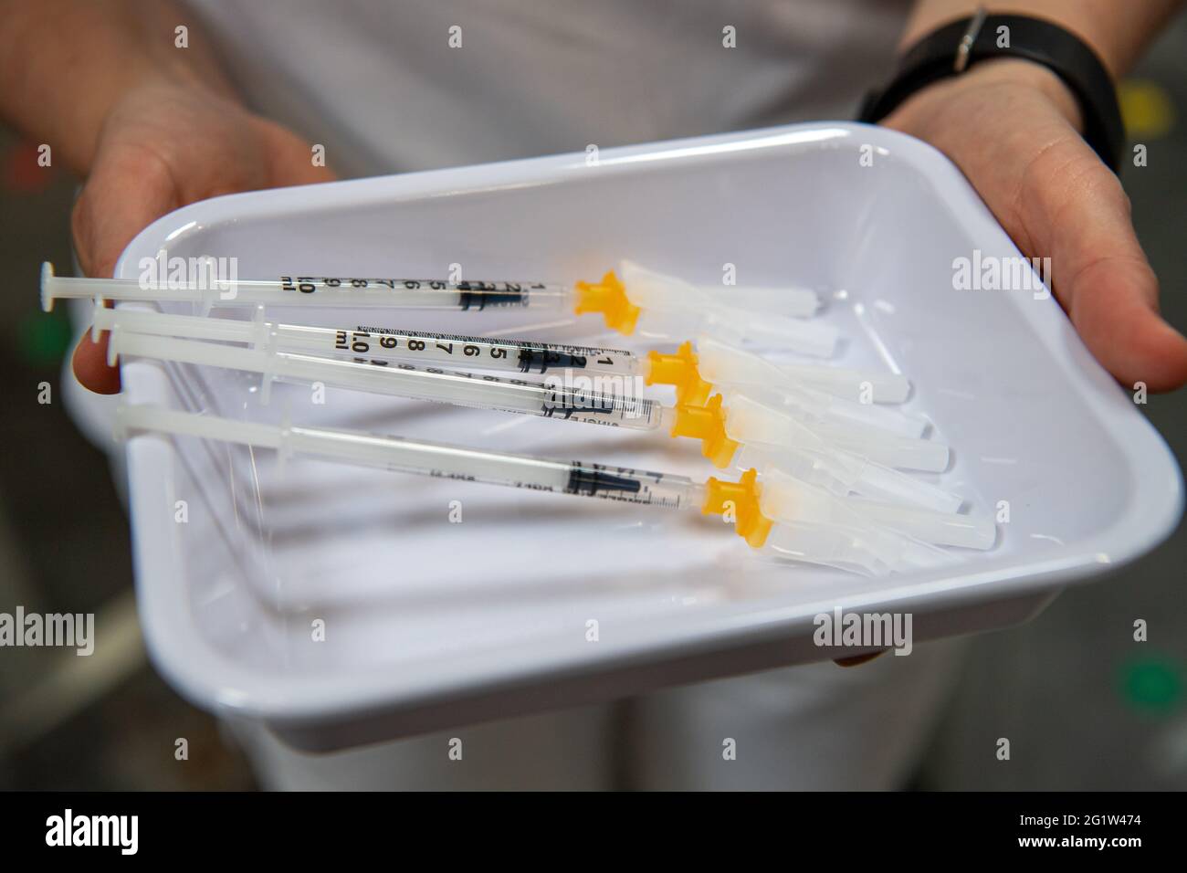 Munich, Germany. 07th June, 2021. A female doctor holds a Petri dish ...