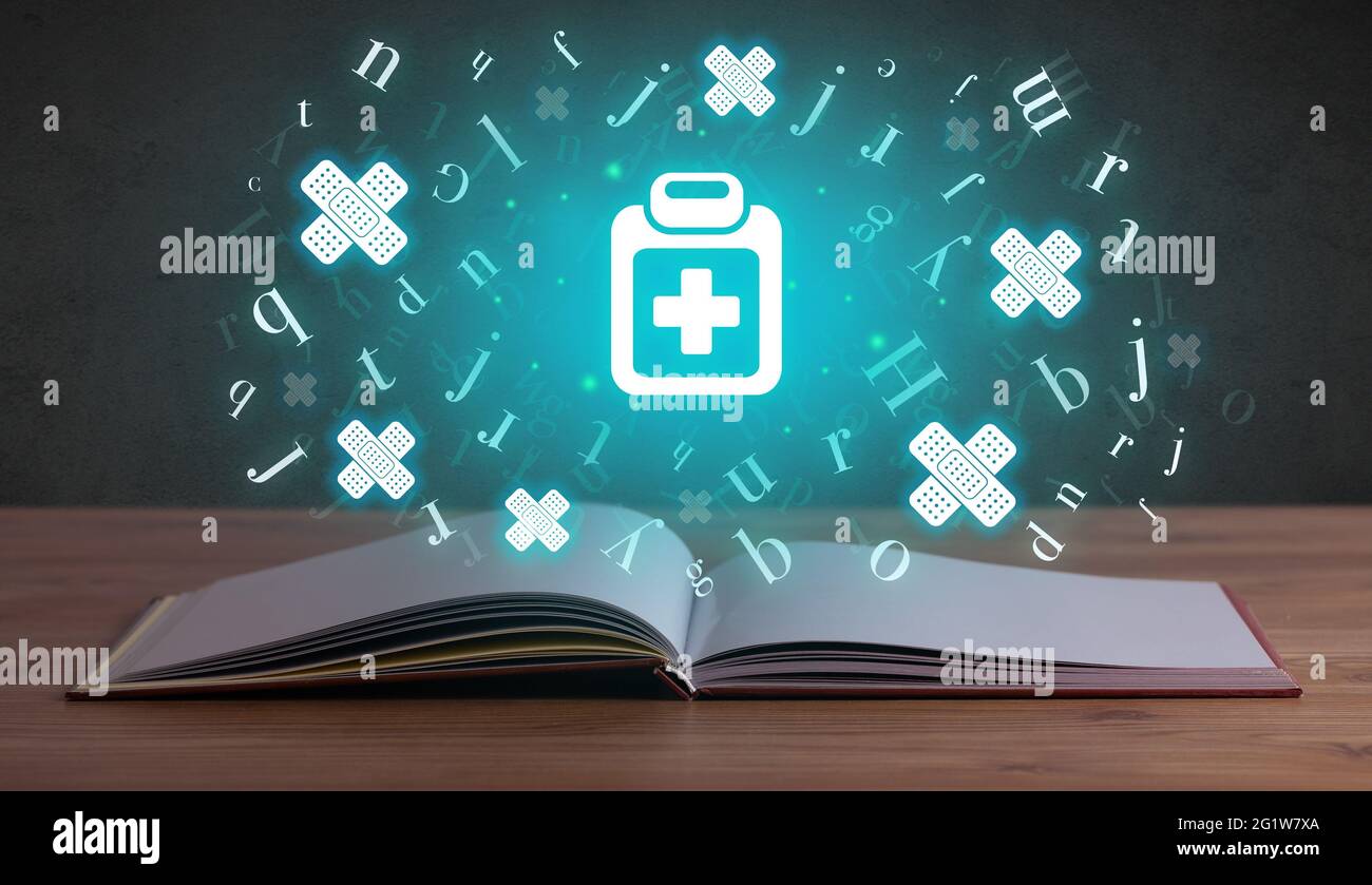 Open medical book with health icons above Stock Photo - Alamy