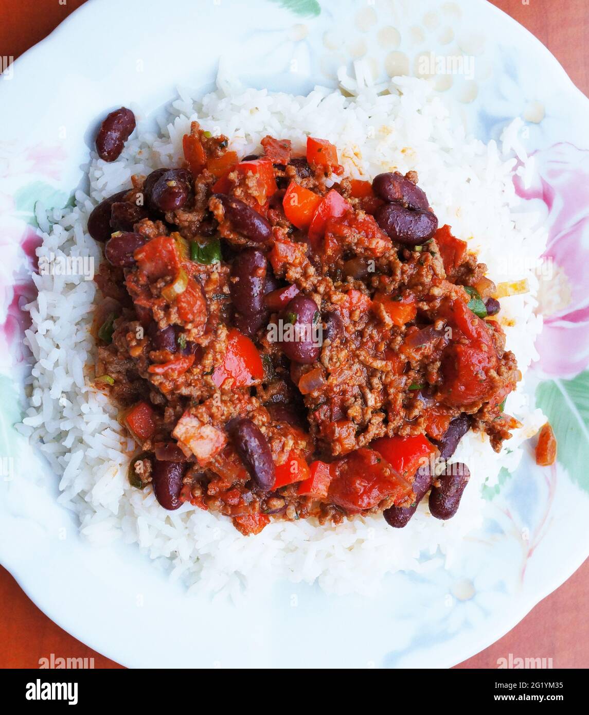 Top view of chili con carne and rice on a white plate Stock Photo - Alamy