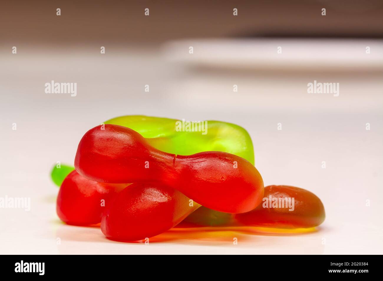 Red and green gummy candies in various shapes Stock Photo - Alamy
