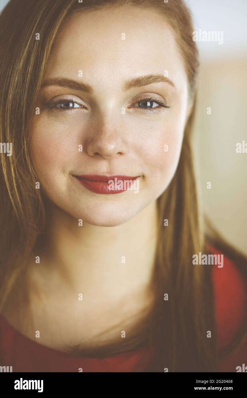 Head shot of a smart confident smiling millennial european woman ...