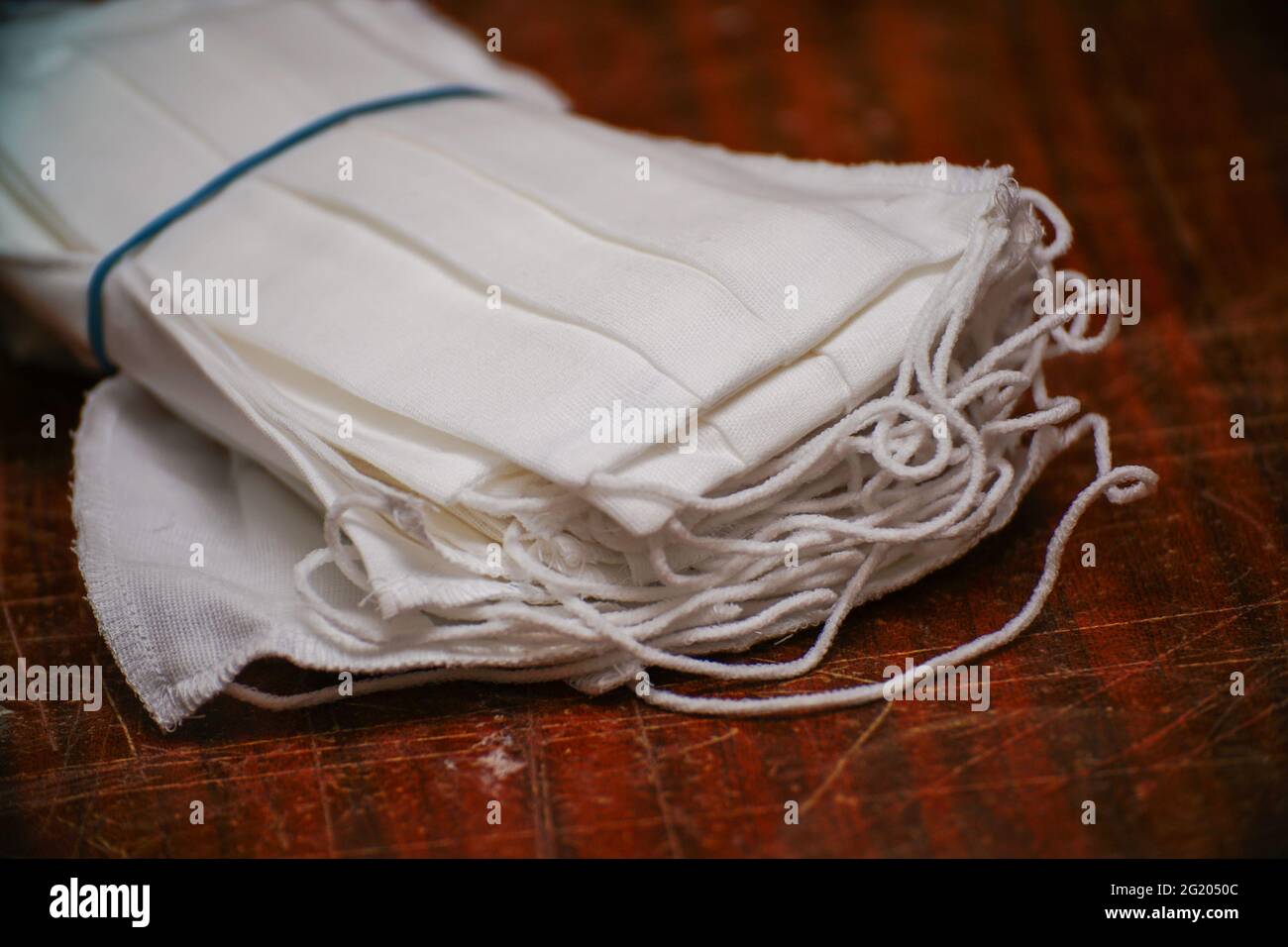 A stack of medical protective masks on a scratched wooden table Stock ...