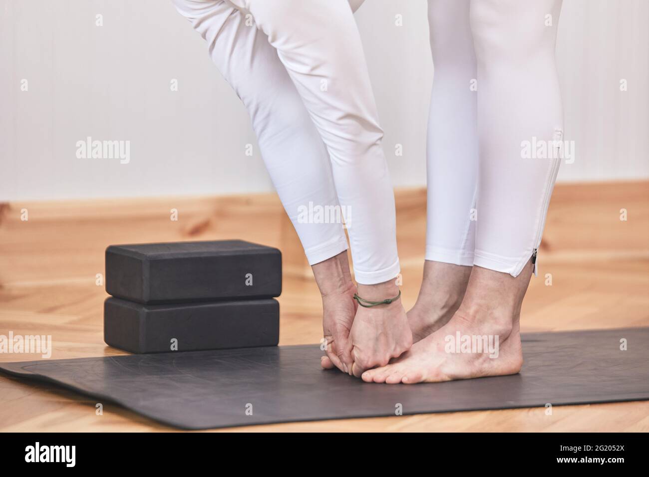 Closed portrait with no visible face of Forward Bend Yoga pose. yoga ...