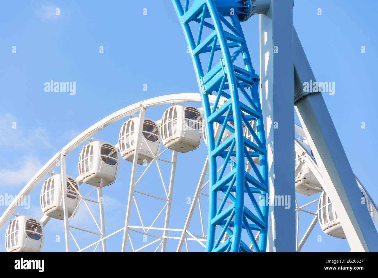 Amusement park rides, ferris wheel roller coaster Stock Photo - Alamy