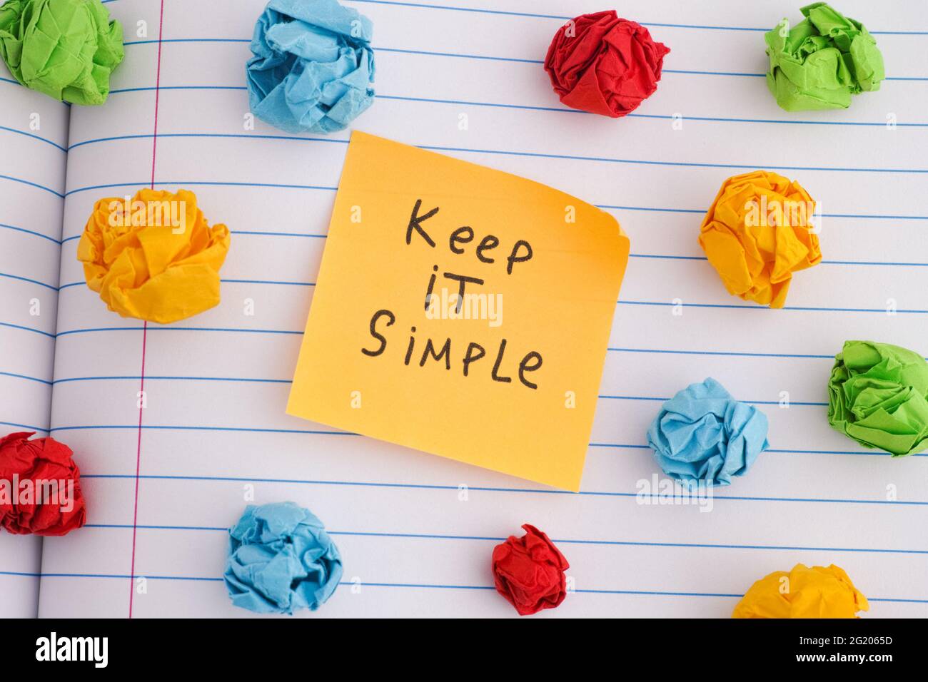 Keep it simple. A yellow paper note with the phrase Keep it simple on ...